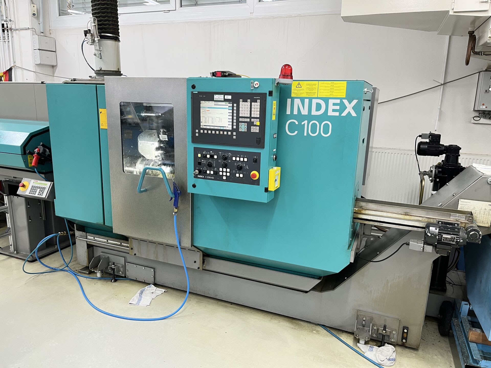 Máquina de tornear CNC INDEX C 100 em segunda mão